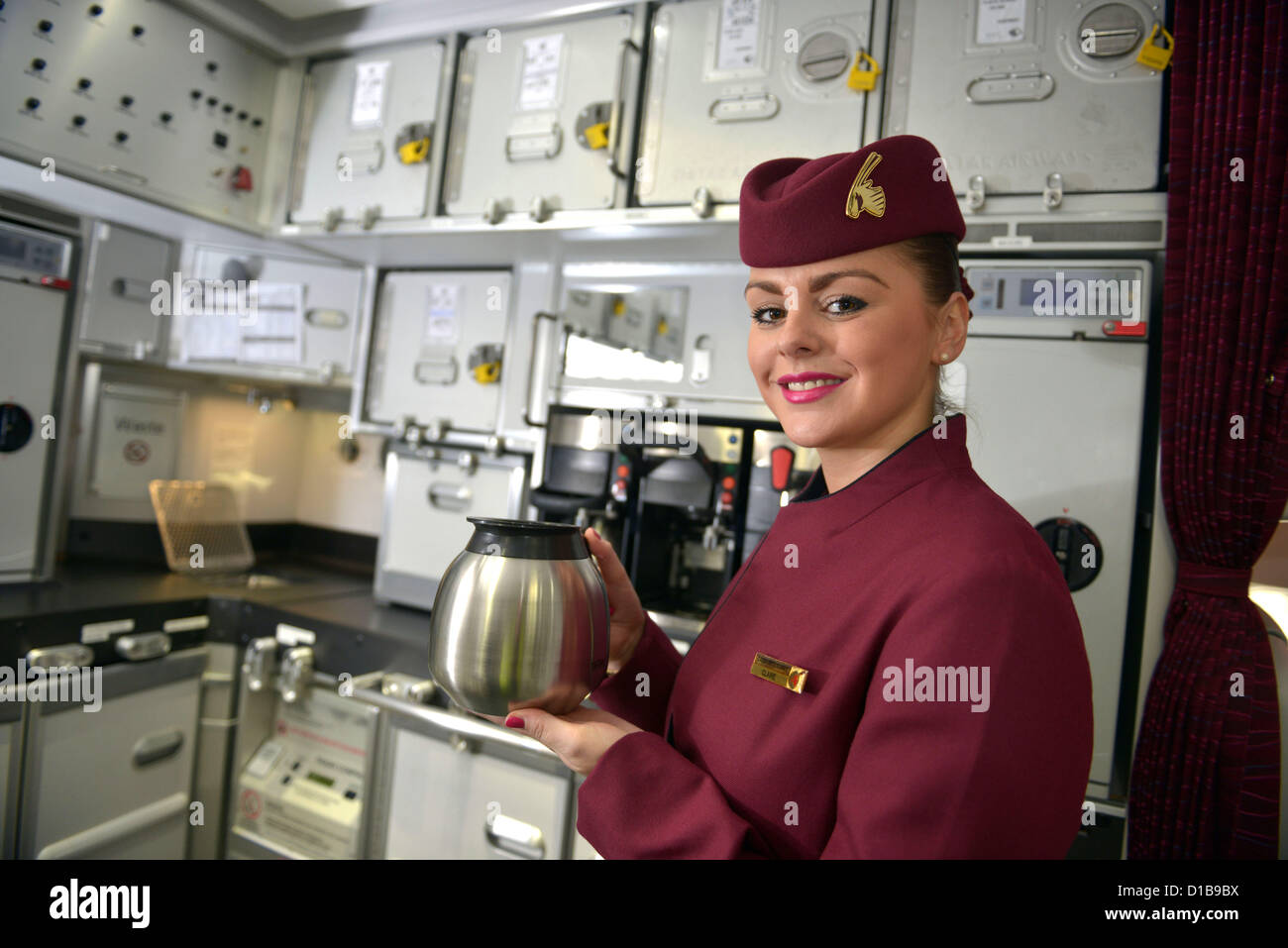 Qatar airways female cabin crew uniform hi-res stock photography and ...