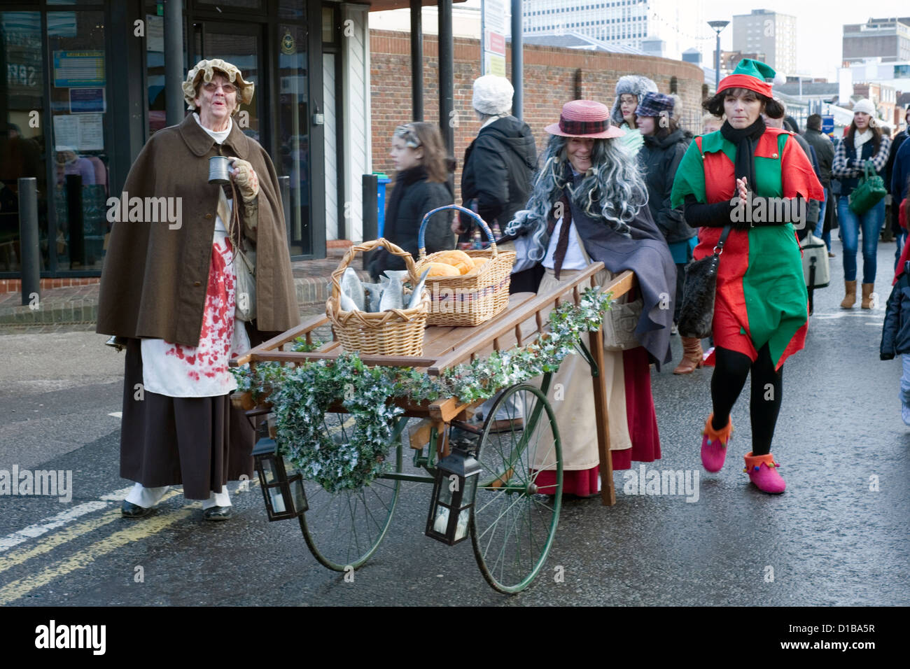 women in period dress one pushing barrow at the victorian festival of ...
