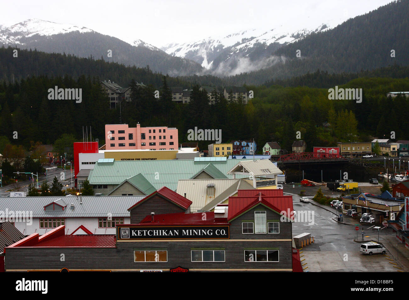 Colorful buildings in Ketchikan, Alaska with mountains in distance ...