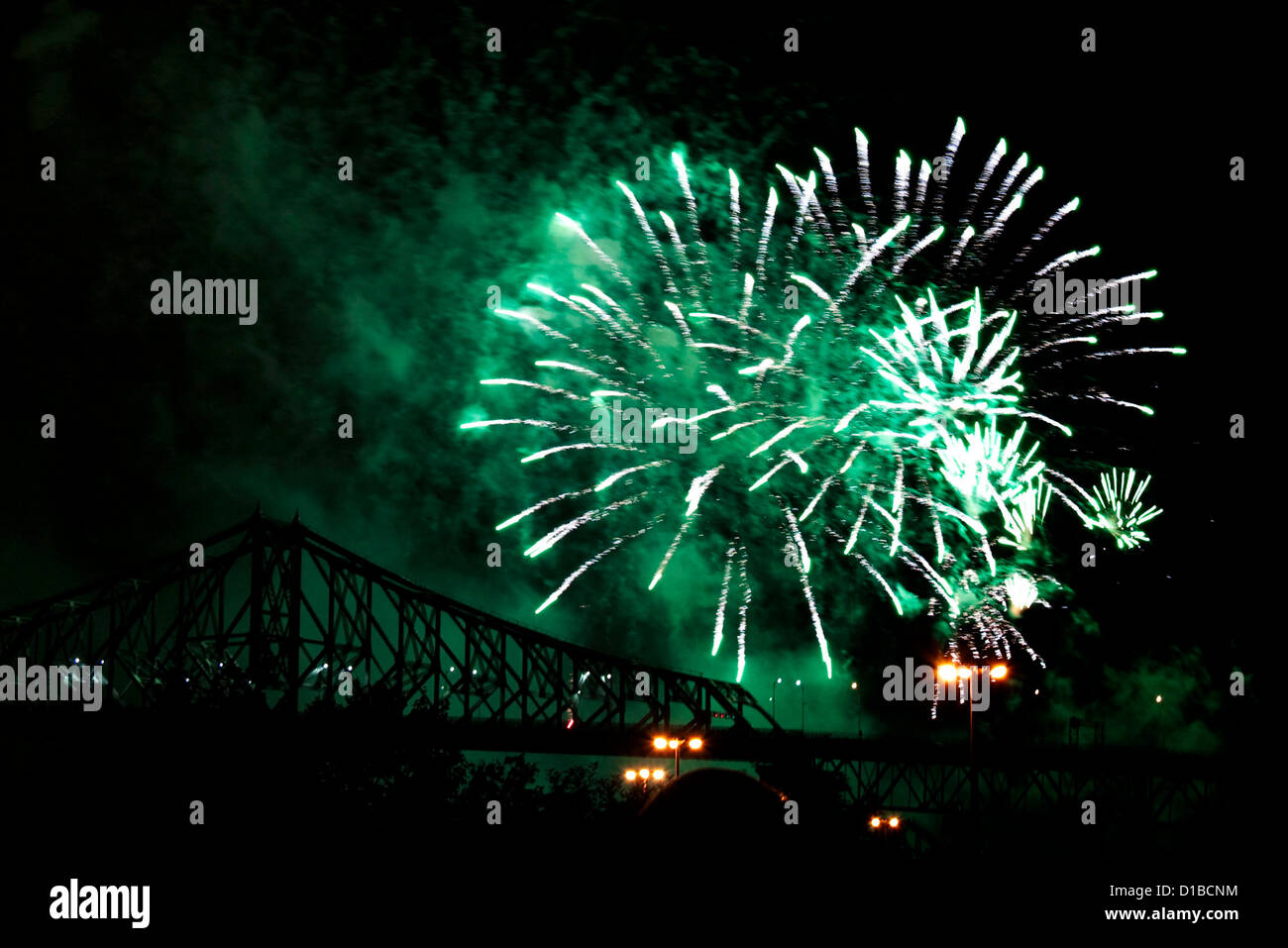 Green fireworks in the night sky near a metal bridge Stock Photo - Alamy