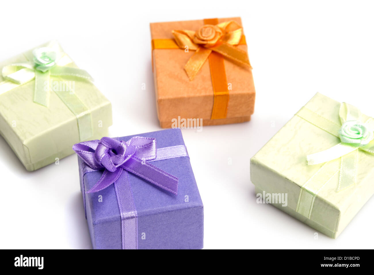 Collection of small red, green, and orange gift boxes Stock Photo - Alamy