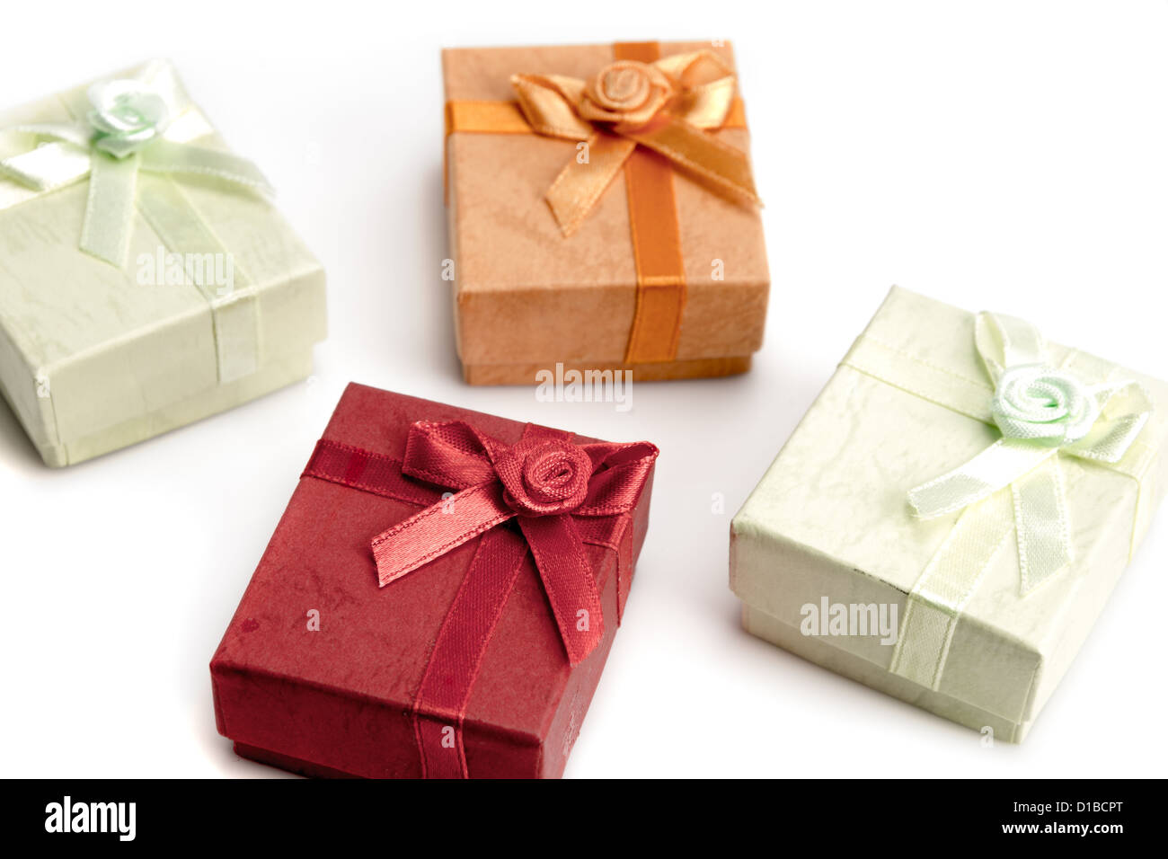 Collection of small red, green, and orange gift boxes Stock Photo - Alamy