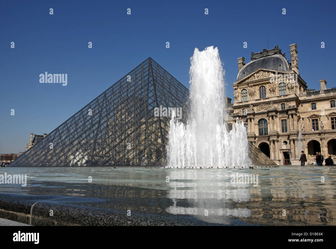 Paris, France, the Louvre glass pyramid Richelieufluegel and fountains ...