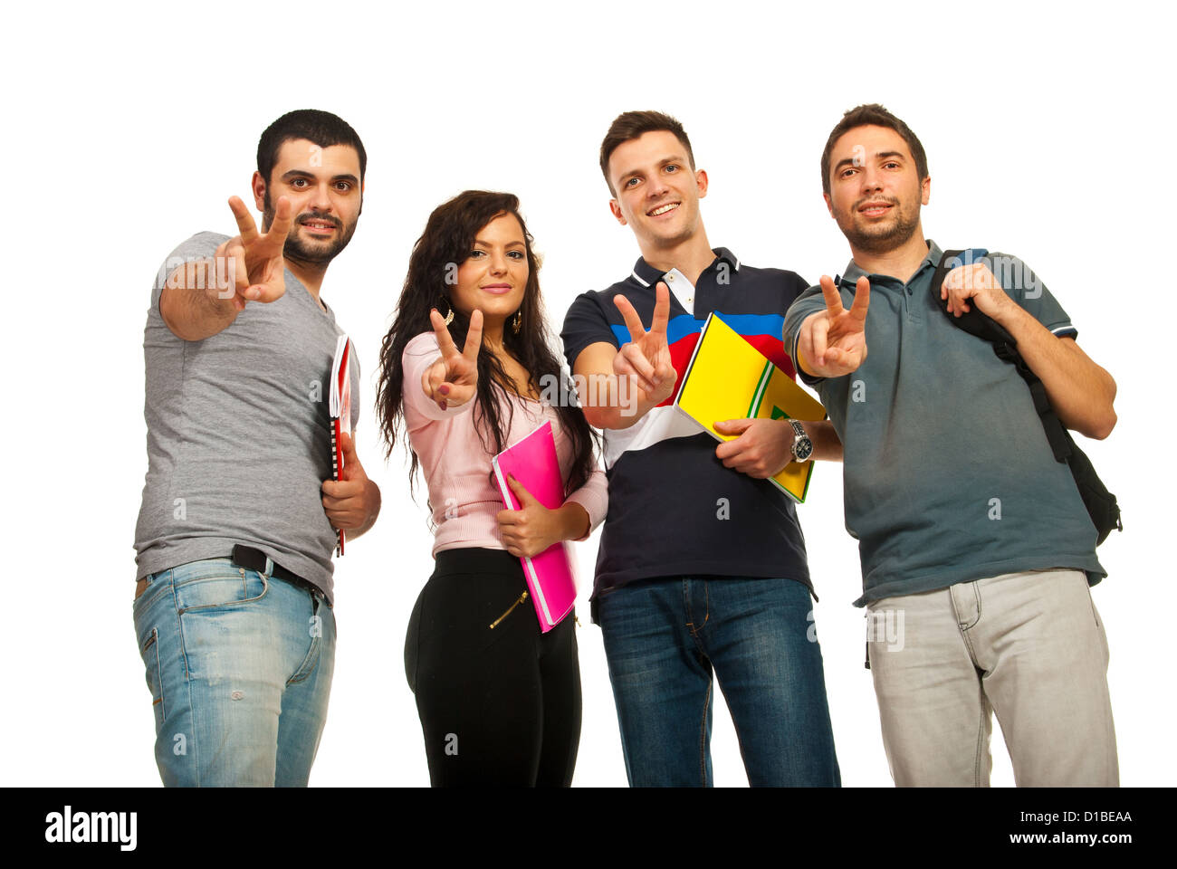 Happy four students showing victory hands gesture isolated on white ...