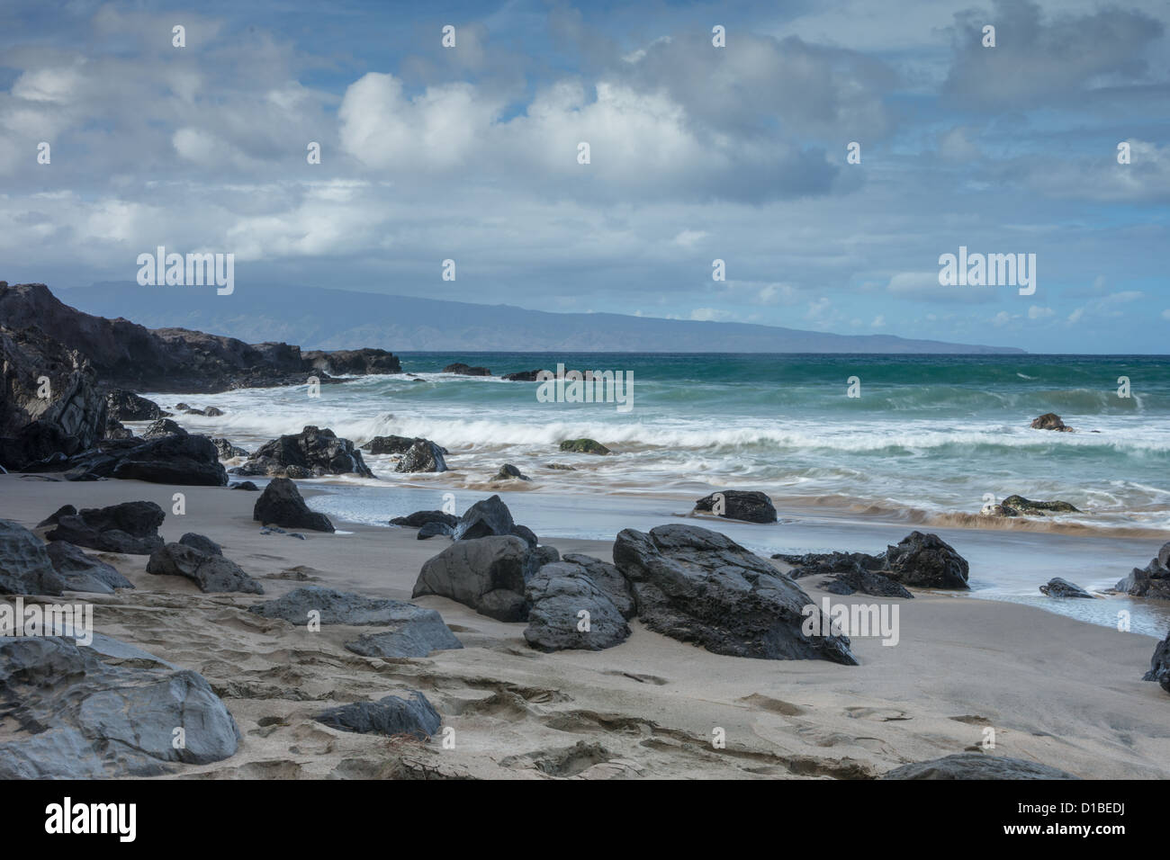 Rocky Maui shoreline with slow moving waves Stock Photo - Alamy