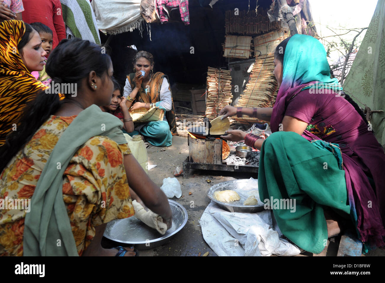 Indian women bake bread in a slum in Jaipur, India, 09 November 2012 ...