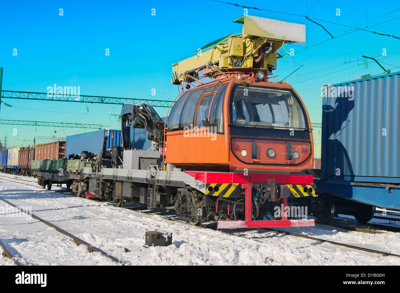 Train crane carriage. Hydraulic crane mounted on a railroad car ...