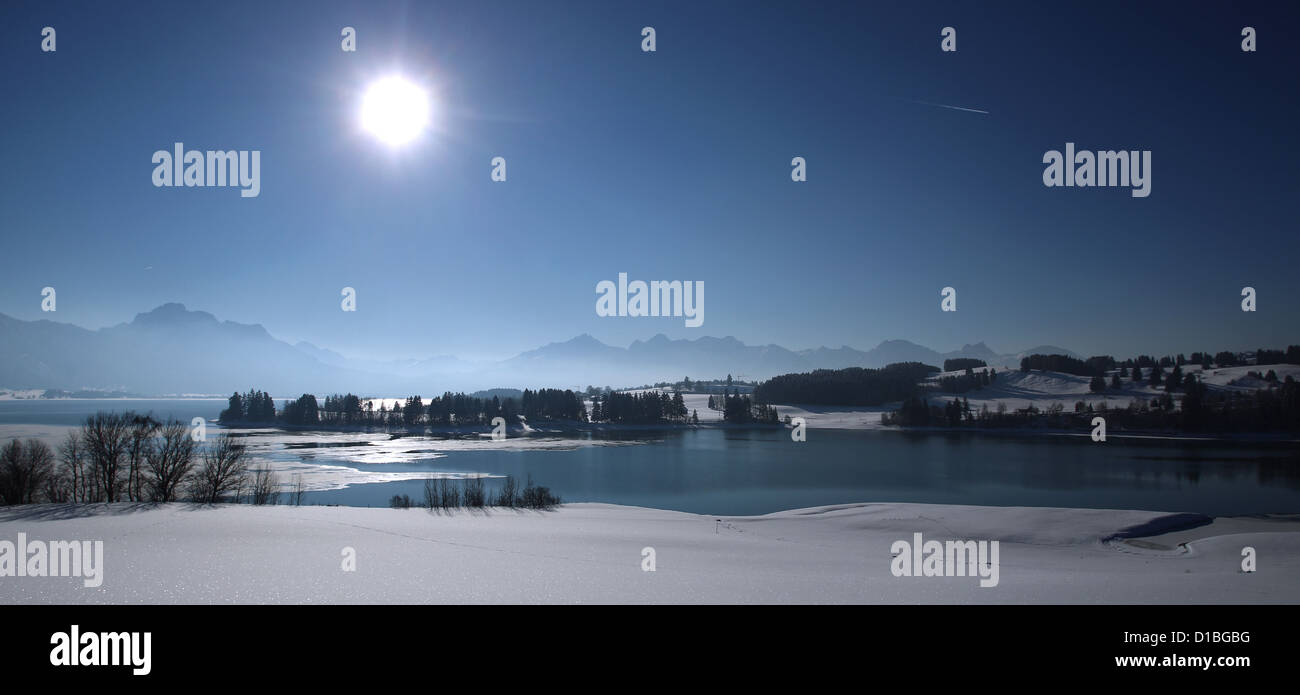 The sun shines above the Forggensee lake near Rosshaupten, Germany, 12 ...