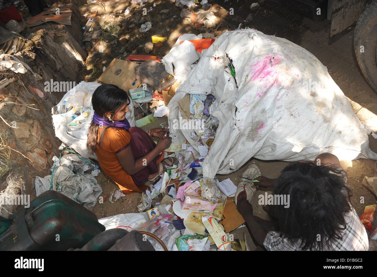 A girl searches through waste in a slum in Jaipur, India, 09 November ...