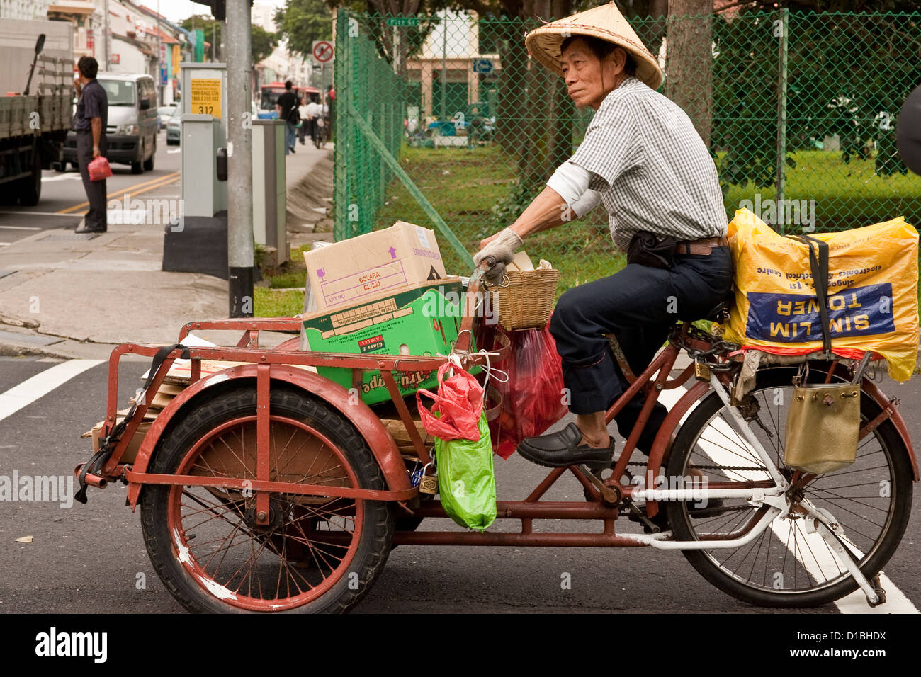 Man on a tricycle, Singapore Stock Photo - Alamy