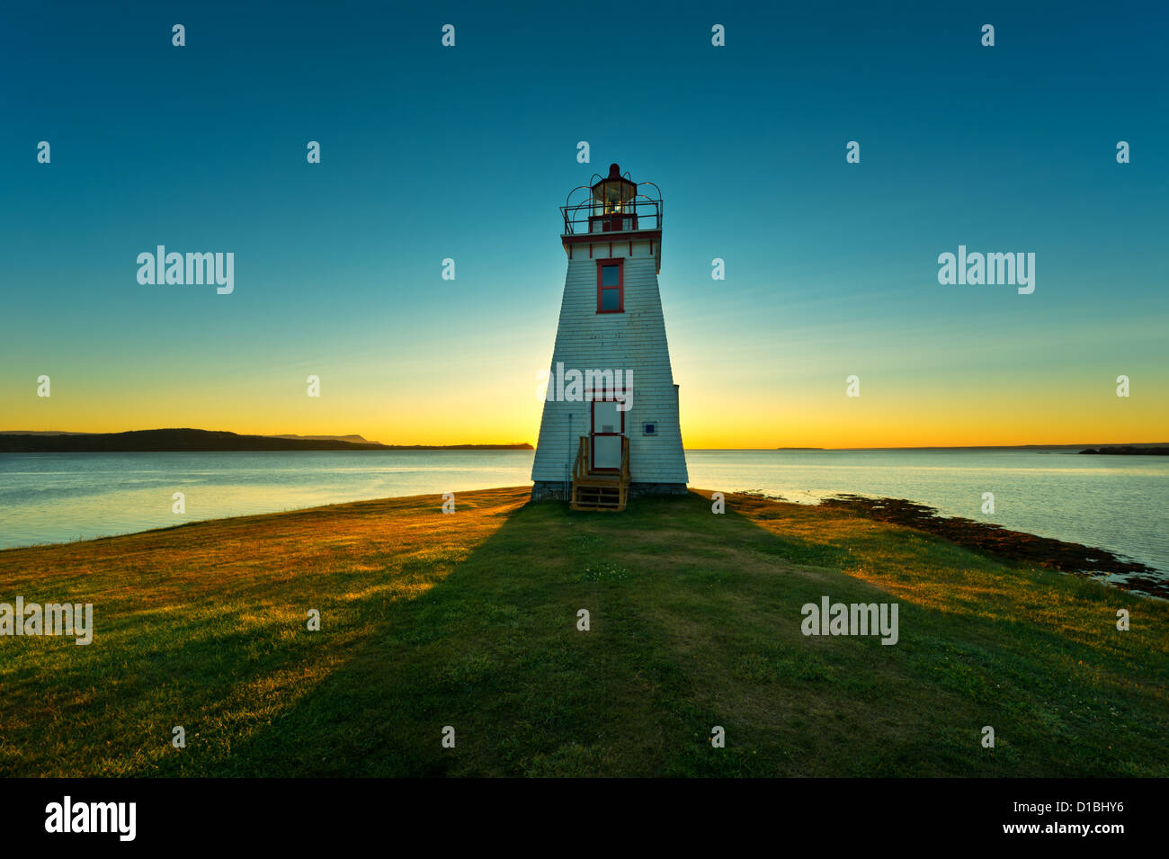 Lighthouse during sunrise in the early morning with beautiful colors ...