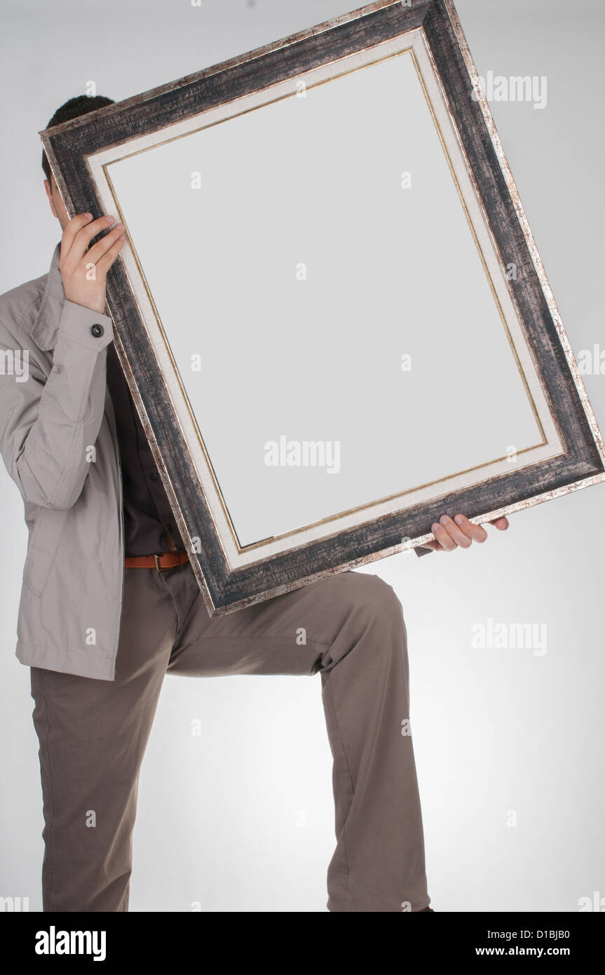 Man holding empty frame Stock Photo - Alamy