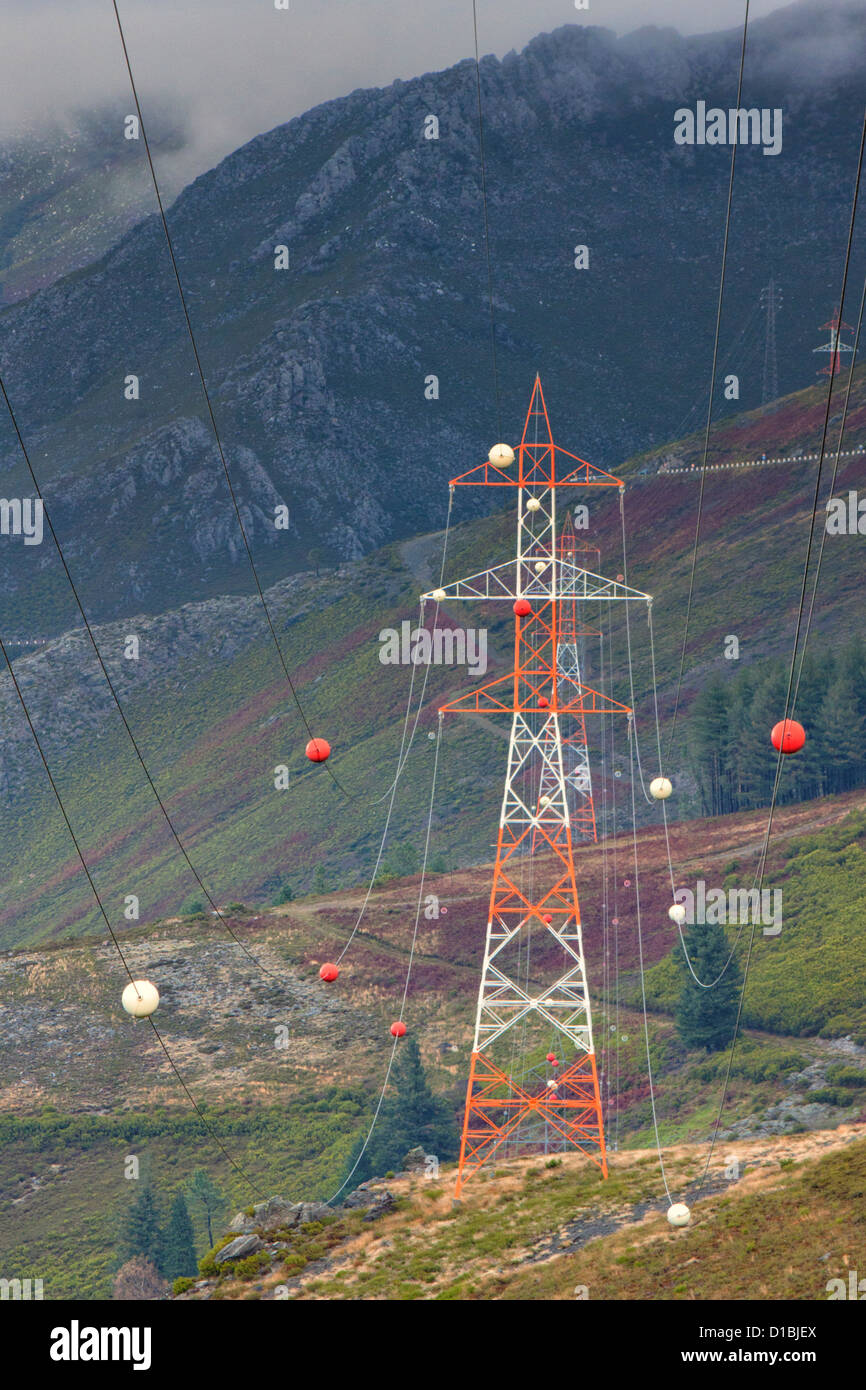 View of electricity tower and cables in the mountains Stock Photo - Alamy