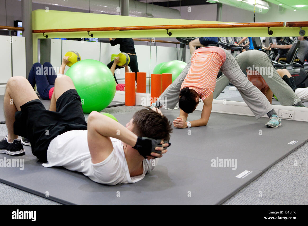 Physical exercising in a gym Stock Photo - Alamy