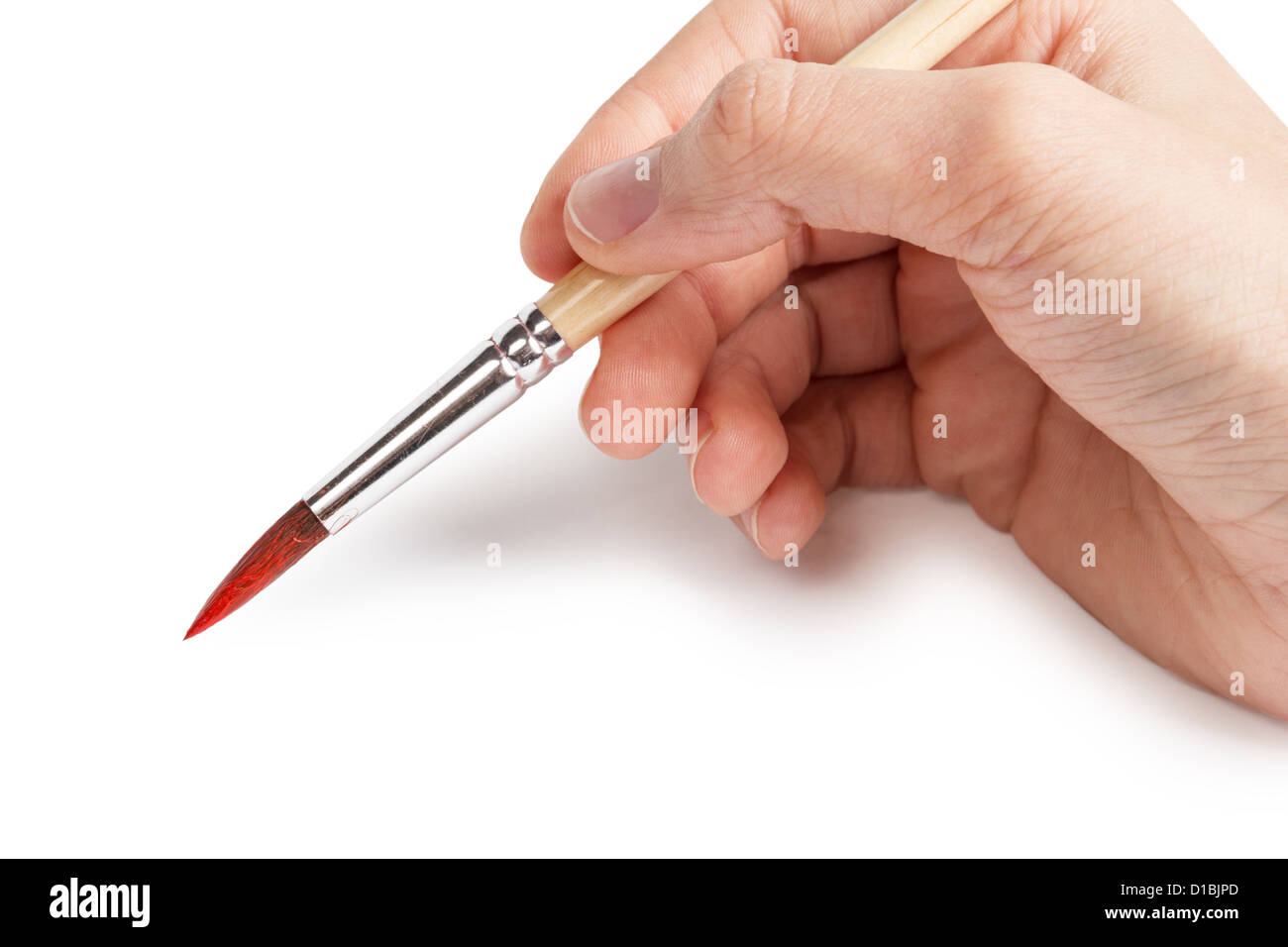 female teen hand with a brush on white background Stock Photo - Alamy