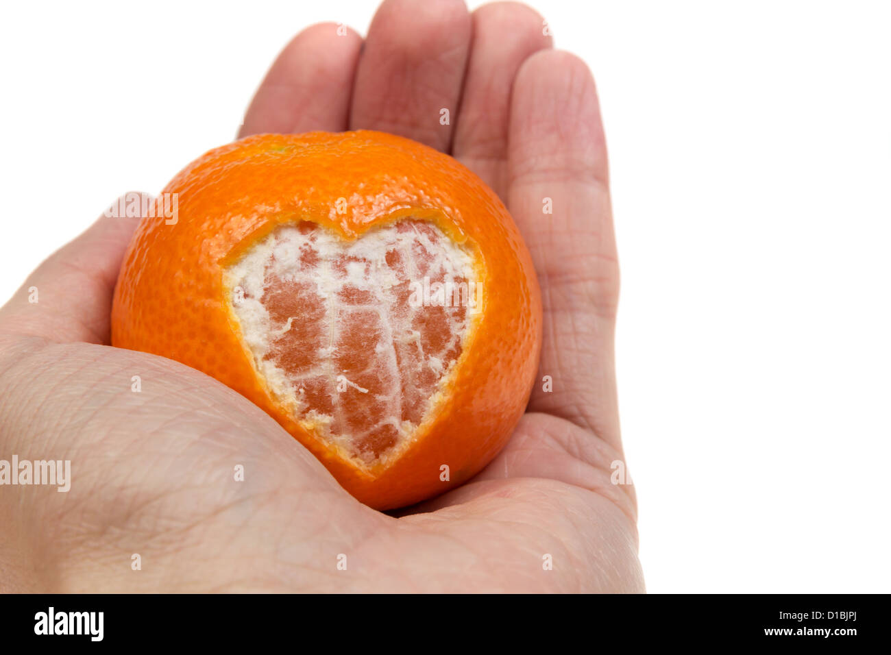 giving tangerine heart in hand over white Stock Photo - Alamy