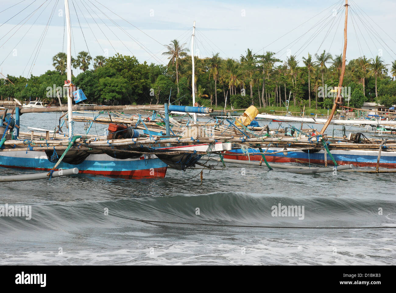 Local Fishing boats with fishermen or fisher at Jimbaran bay, beach at ...