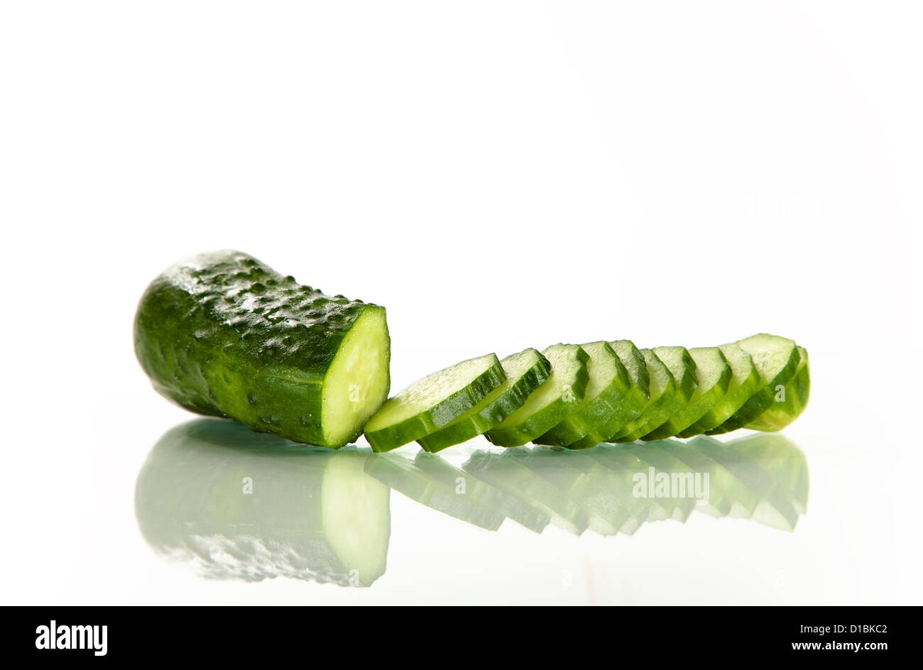 Fresh sliced cucumber, isolated on white background Stock Photo - Alamy