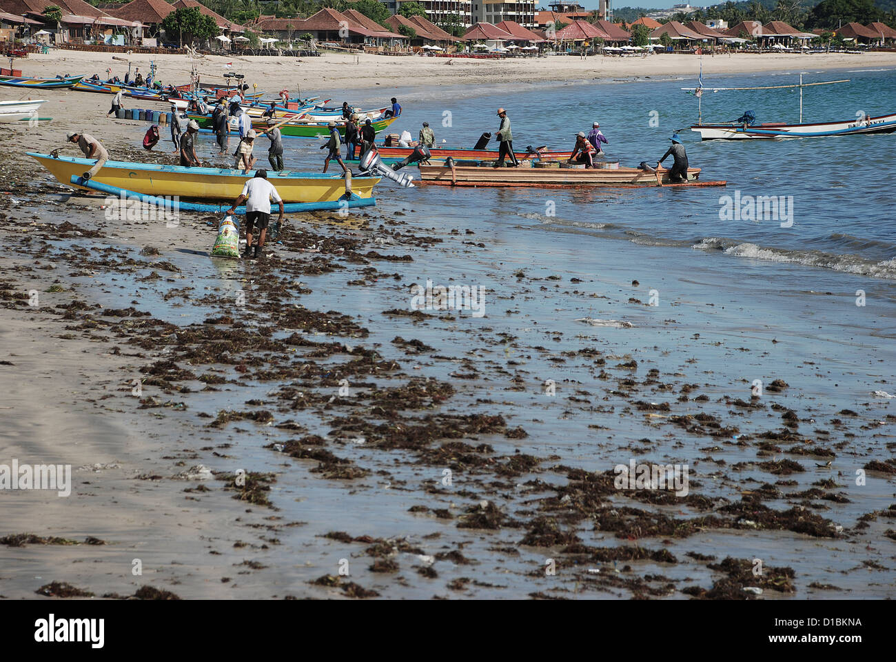 Local Fishing boats with fishermen or fisher at Jimbaran bay, beach at ...