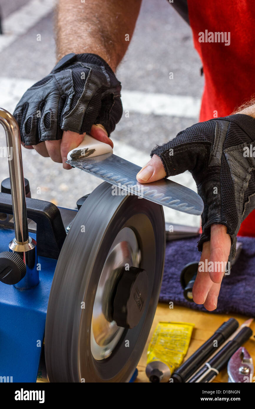 Stropping wheel for final polishing of sharpened knife Stock Photo - Alamy