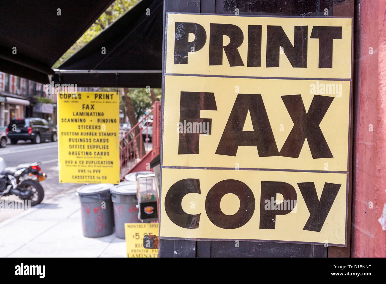 A neighborhood store with a sign of Print, Fax and Copy Stock Photo - Alamy
