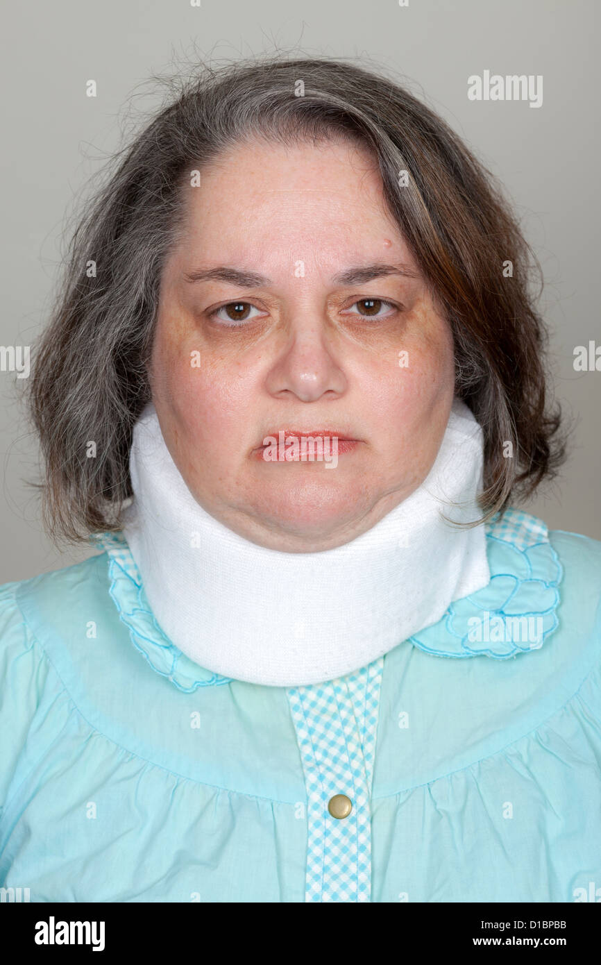 A middle aged woman wearing a cervical collar Stock Photo - Alamy