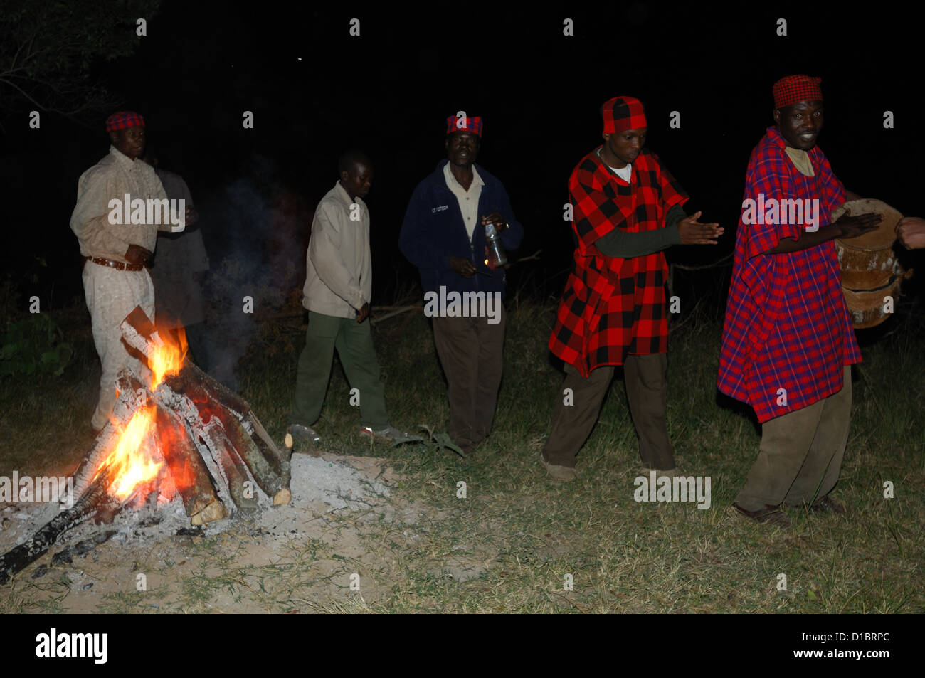 African People Dancing Around Fire