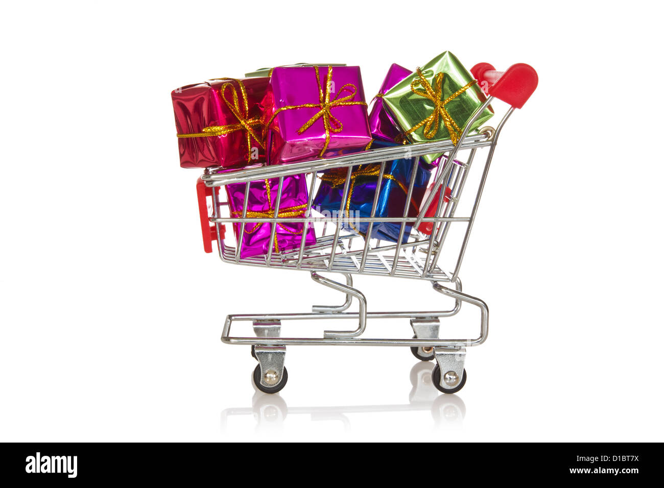 Shopping cart with colorful gift boxes. Isolated on white background ...