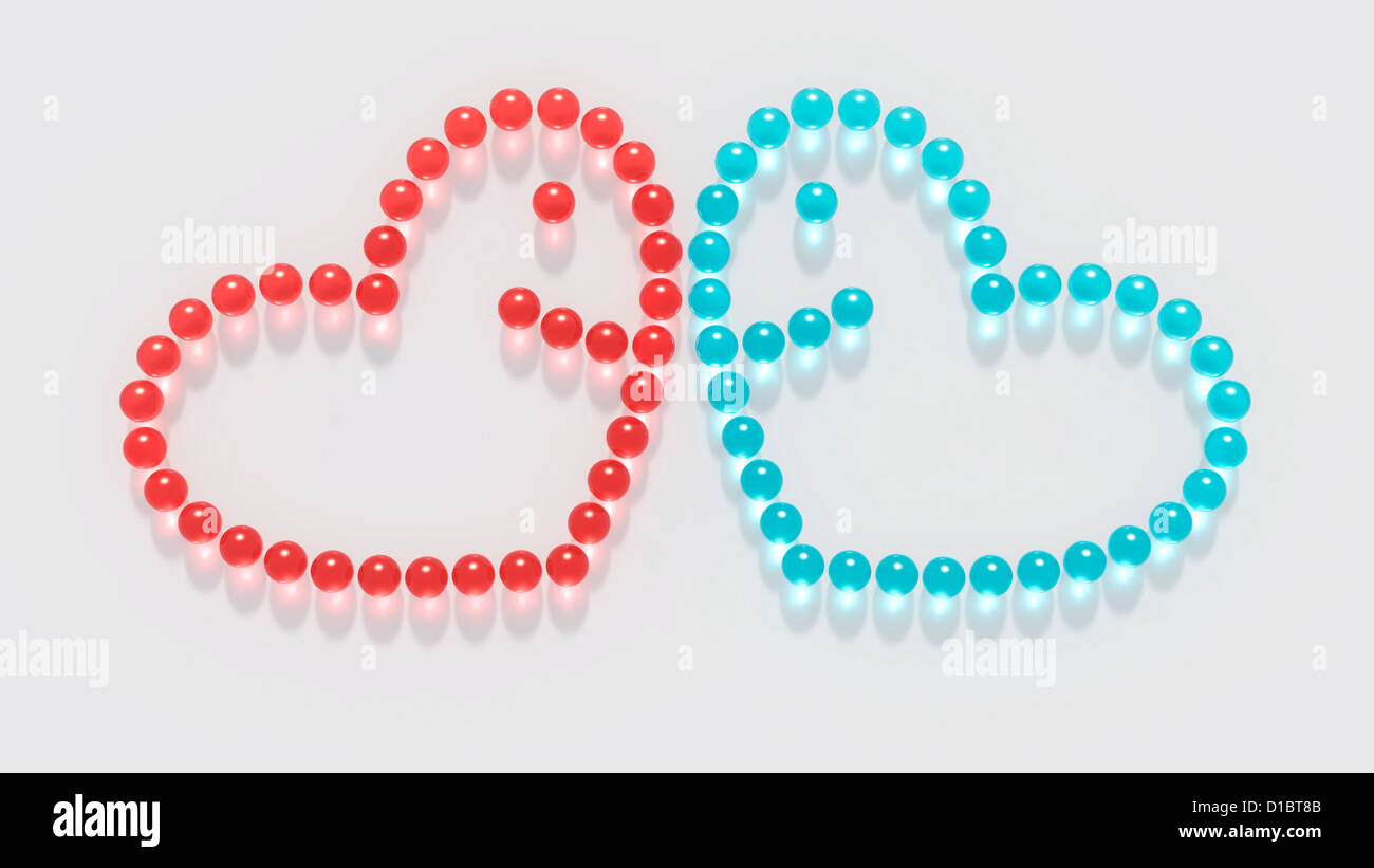 Marbles arranged in two cute heart shapes, smiling and maybe kissing ...