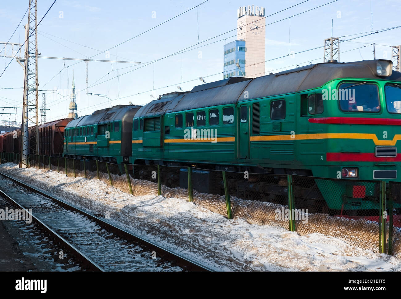 Diesel locomotive with cargo on winter station Stock Photo - Alamy