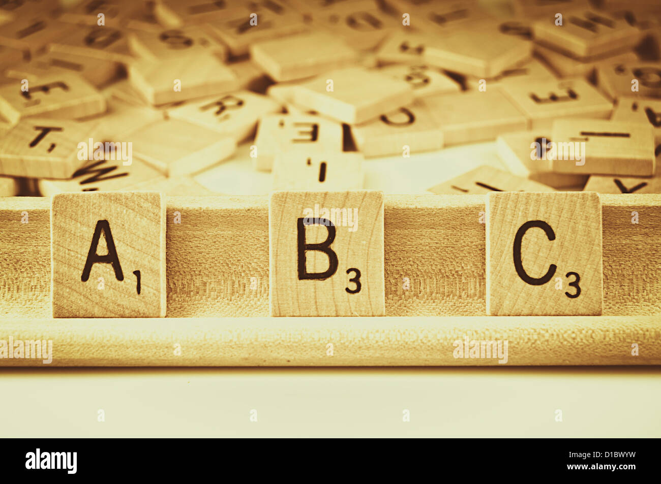 ABC word spelled with scrabble tiles Stock Photo - Alamy