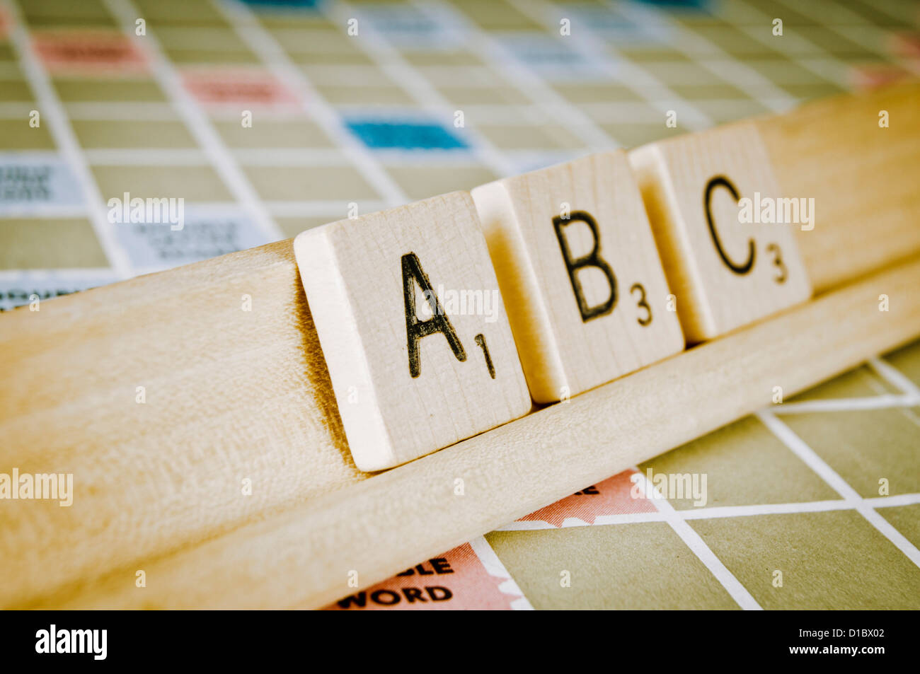 ABC word spelled with scrabble tiles Stock Photo - Alamy