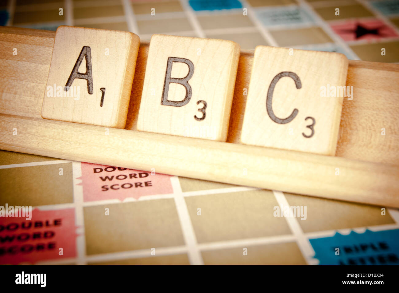 ABC word spelled with scrabble tiles Stock Photo - Alamy