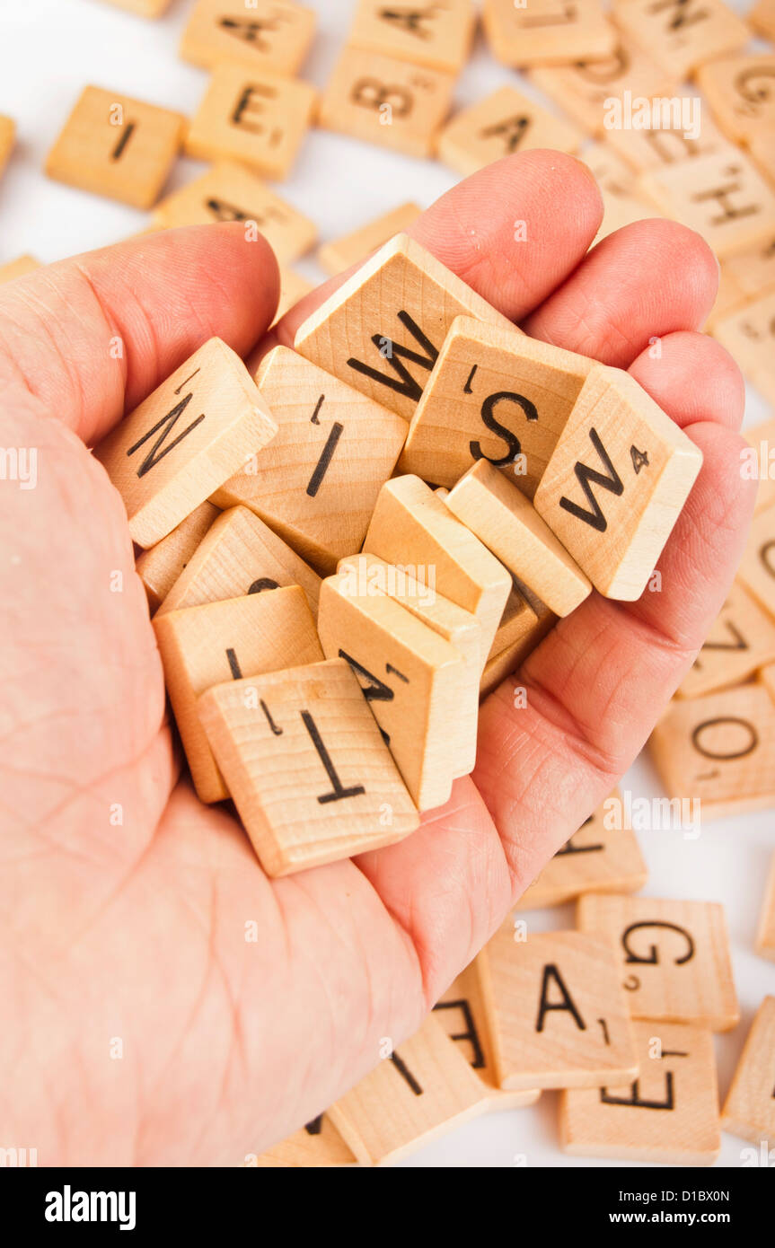 Scrabble tiles in hand Stock Photo - Alamy