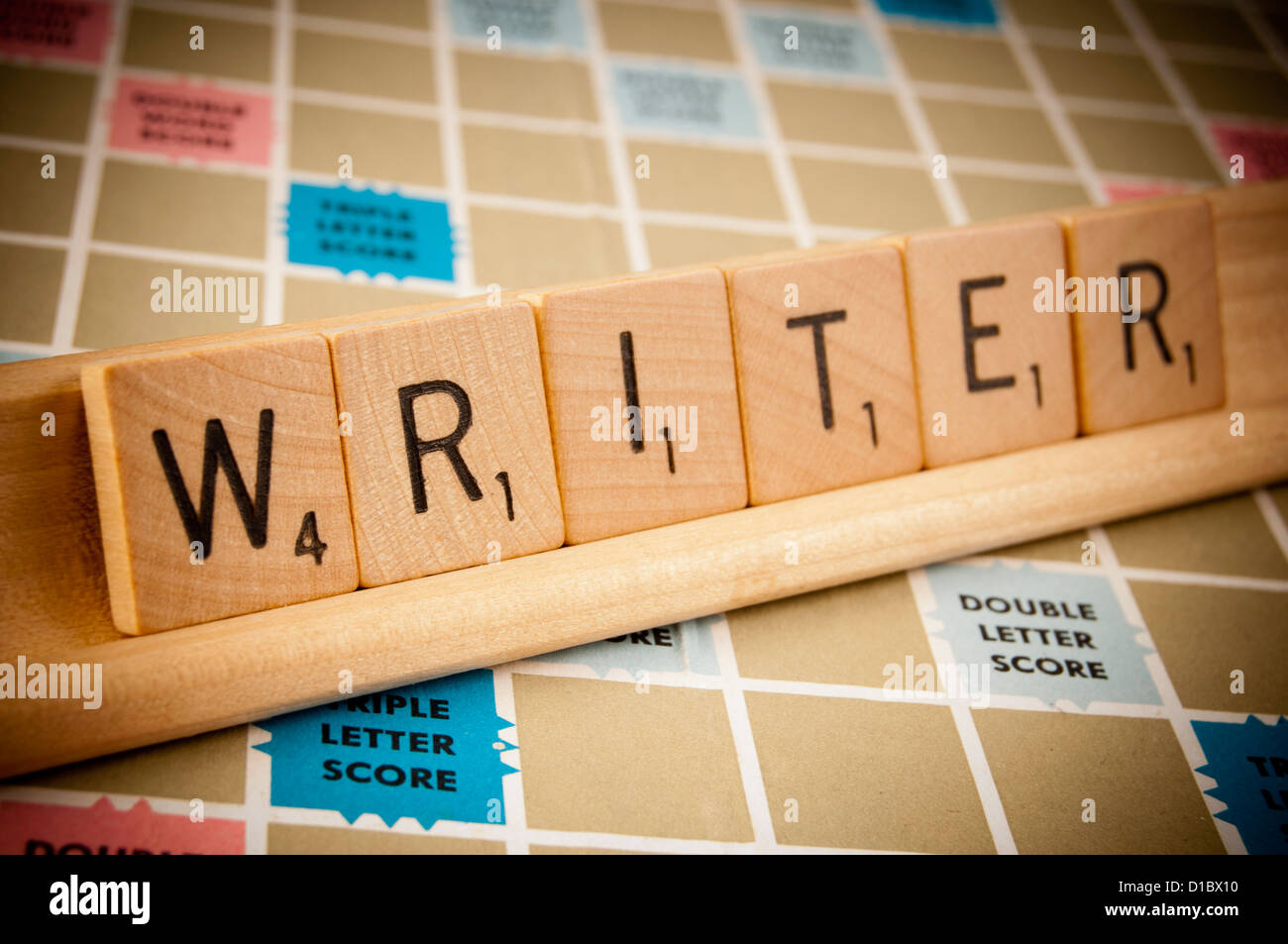 writer word spelled with scrabble tiles Stock Photo - Alamy
