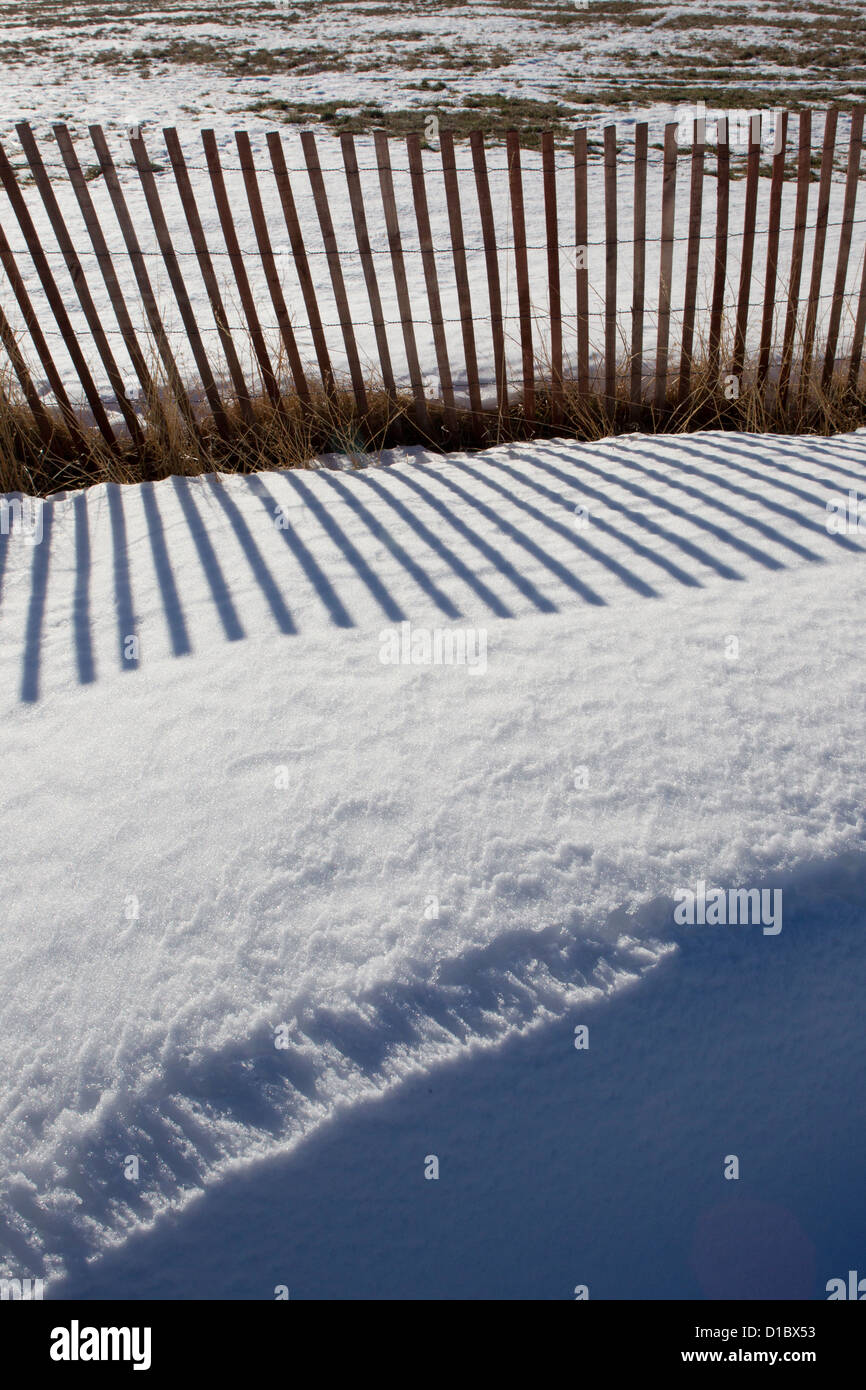 Snow drift behind snow fence Stock Photo - Alamy
