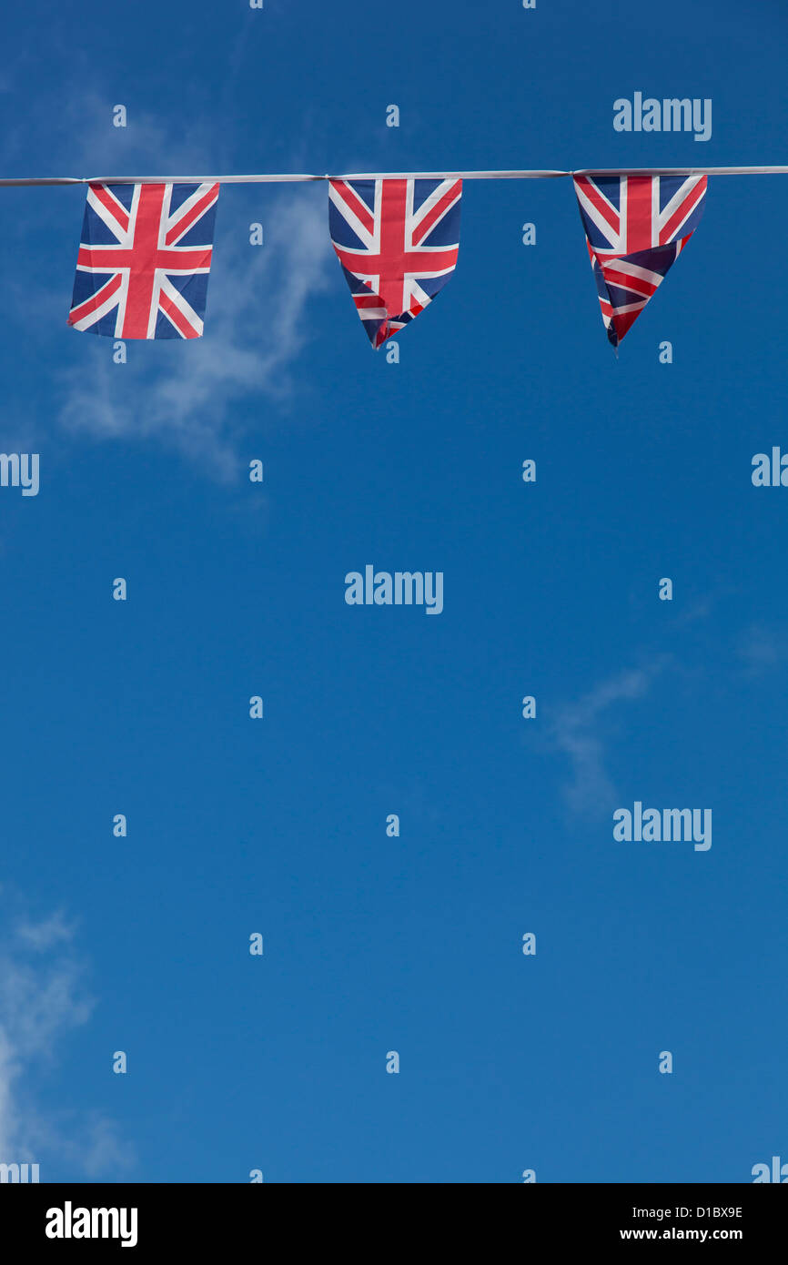 String of Union flags against a blue sky Stock Photo - Alamy