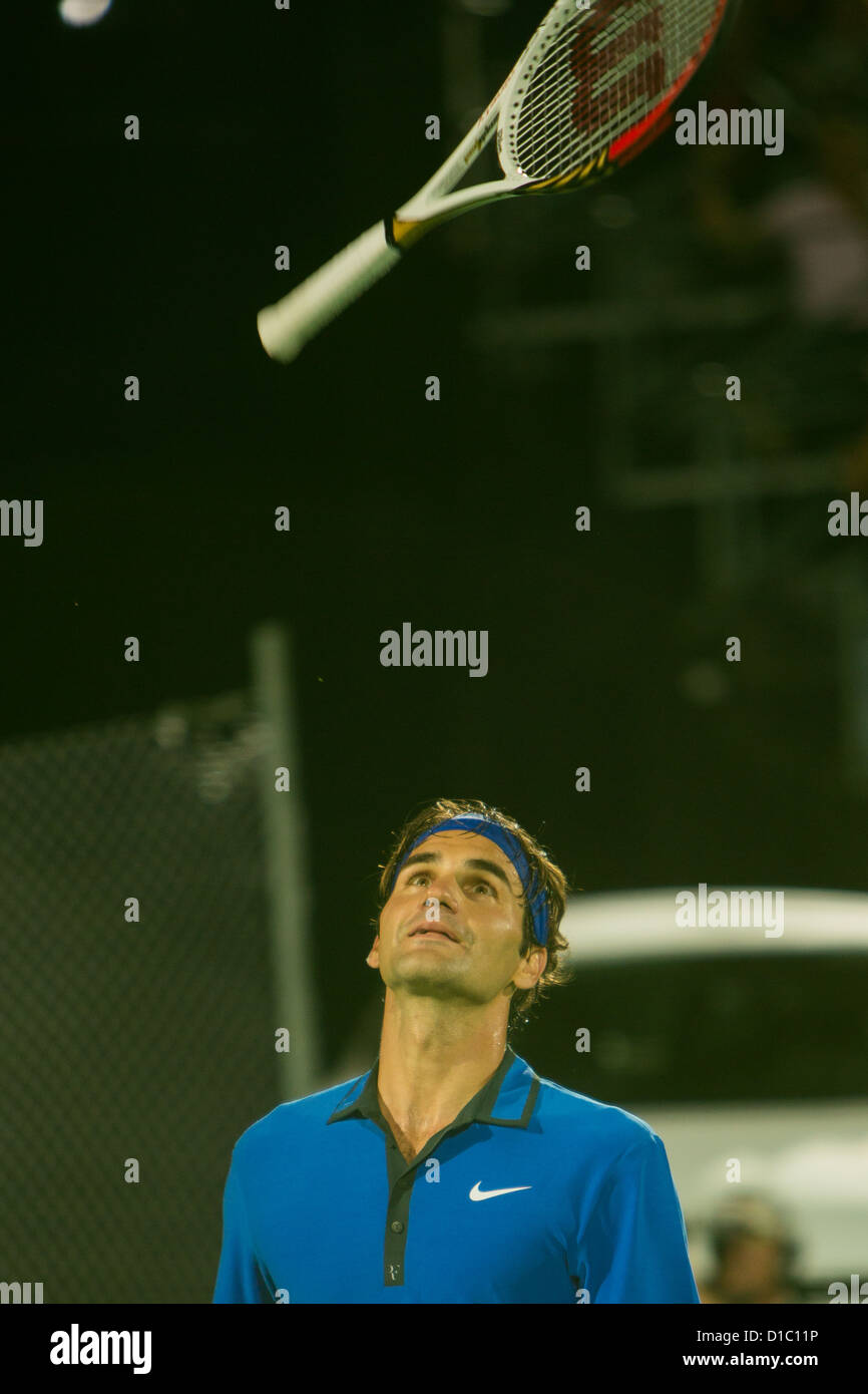 Roger Federer throwing his racket up during an exhibition match vs Juan ...