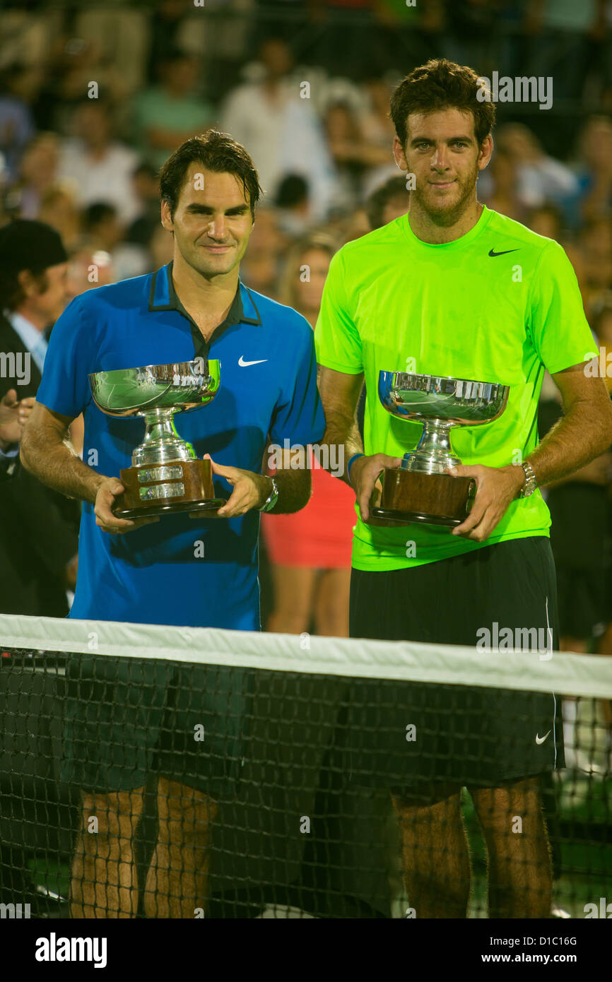 Juan Martin Del Potro and Roger Federer reciving a trophy in an ...