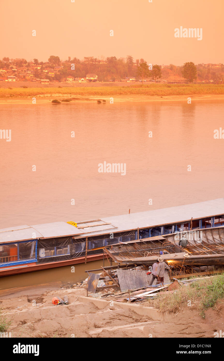 Banks of Mekong River looking towards Laos at dusk, Chiang Khong ...