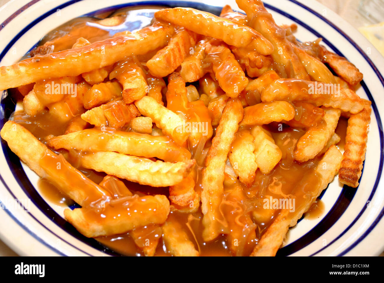 Poutine fries hi-res stock photography and images - Alamy