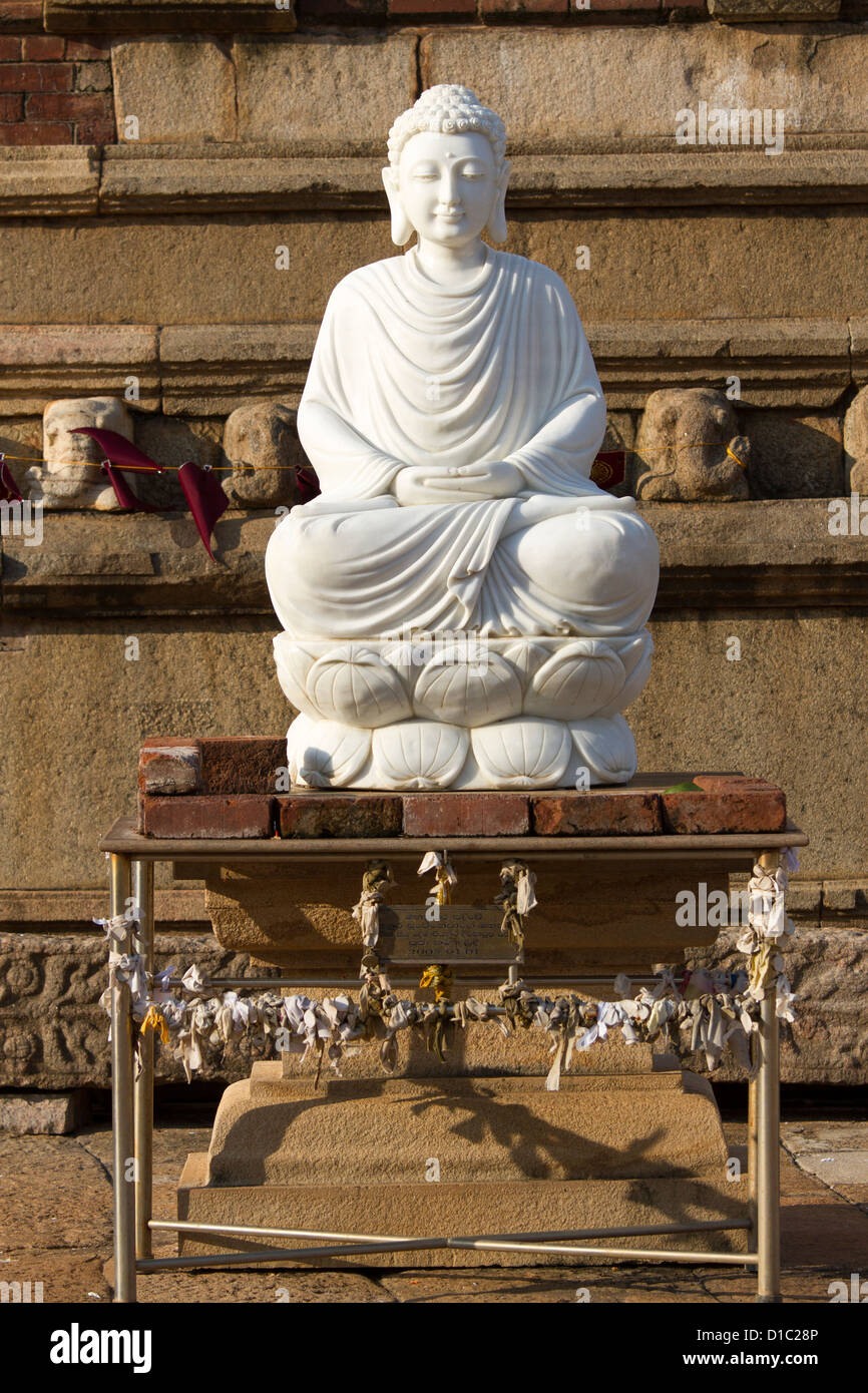 White marble lotus position Buddha statue at dagoba in Anuradhapura ...