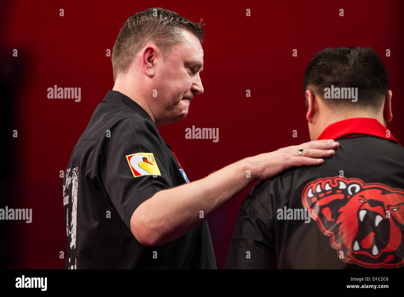 14.12.2012 London, England. Kevin Painter consoles Leung Chung Nam ...