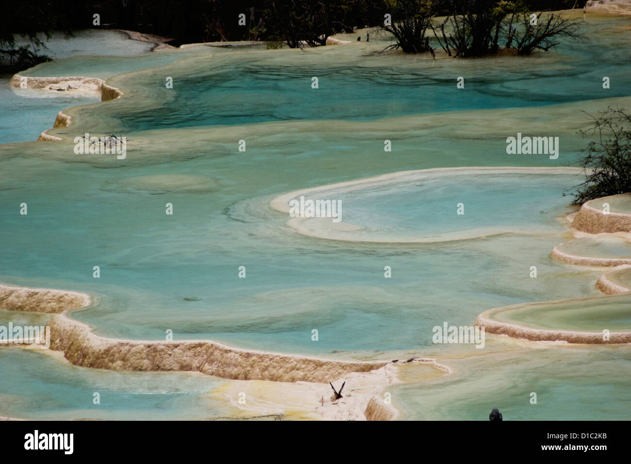 Pools formed by calcite deposits in Huanglong nature reserve literally ...