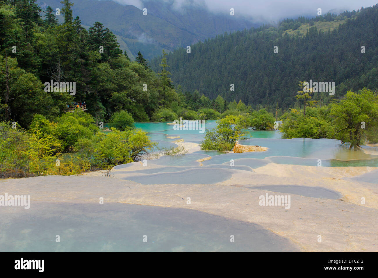 Pools formed by calcite deposits in Huanglong nature reserve literally ...