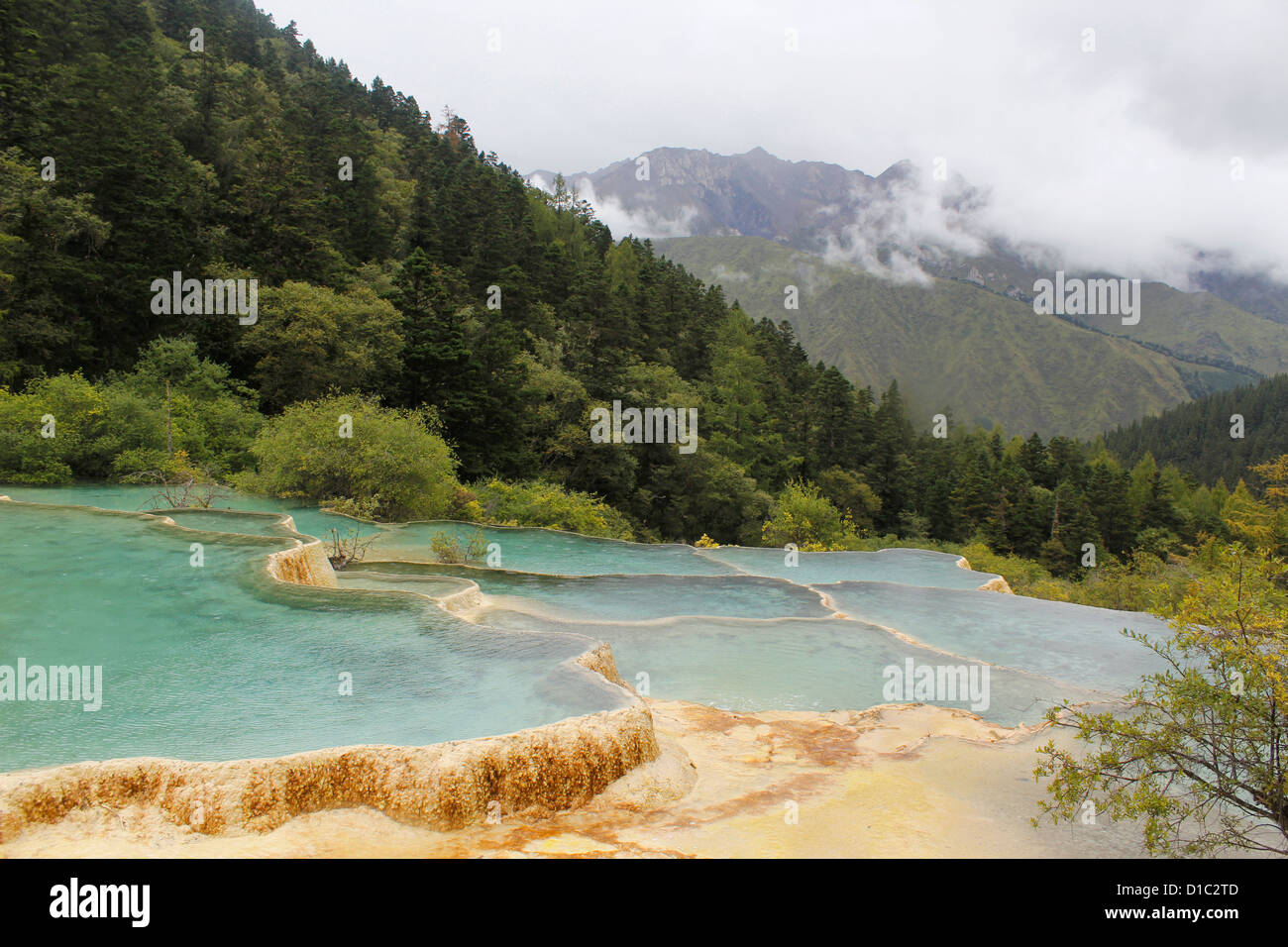 Pools formed by calcite deposits in Huanglong nature reserve literally ...