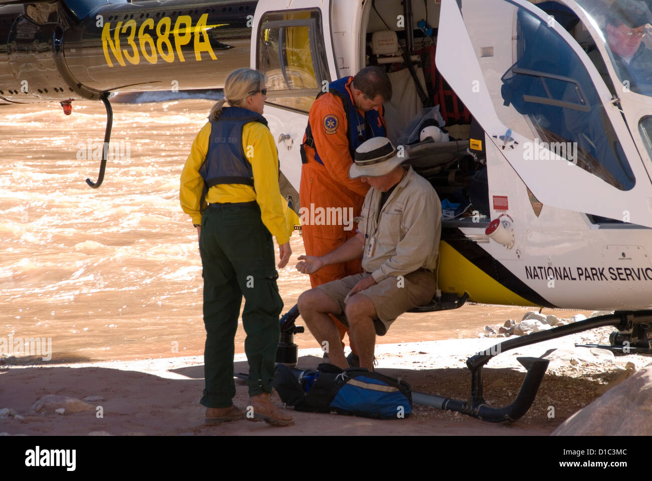 Paramedic checking out a patient on a National Park Service rescue ...