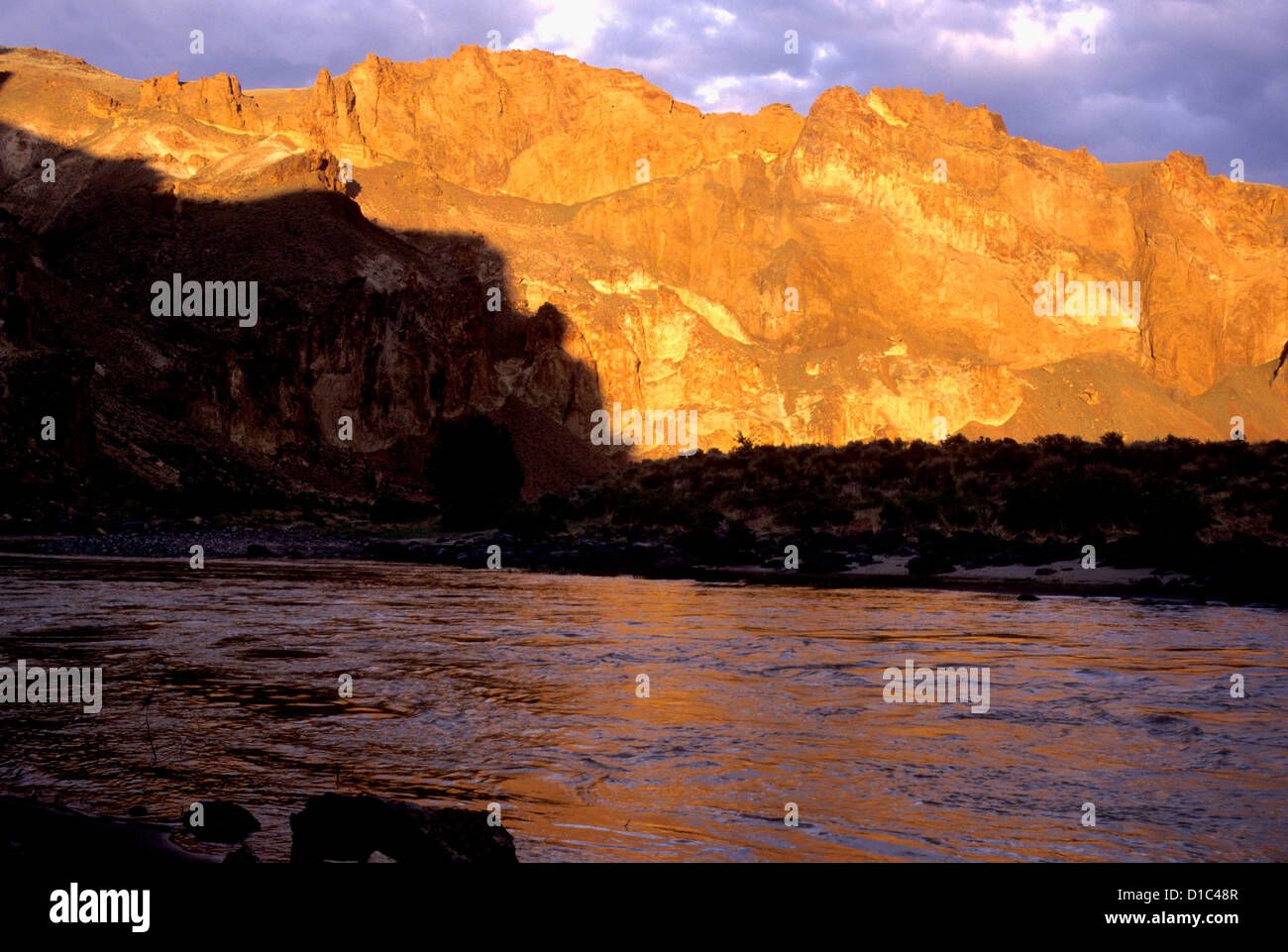 Alpenglow (sunset) reflected off of cliffs above Owyhee River in SE ...