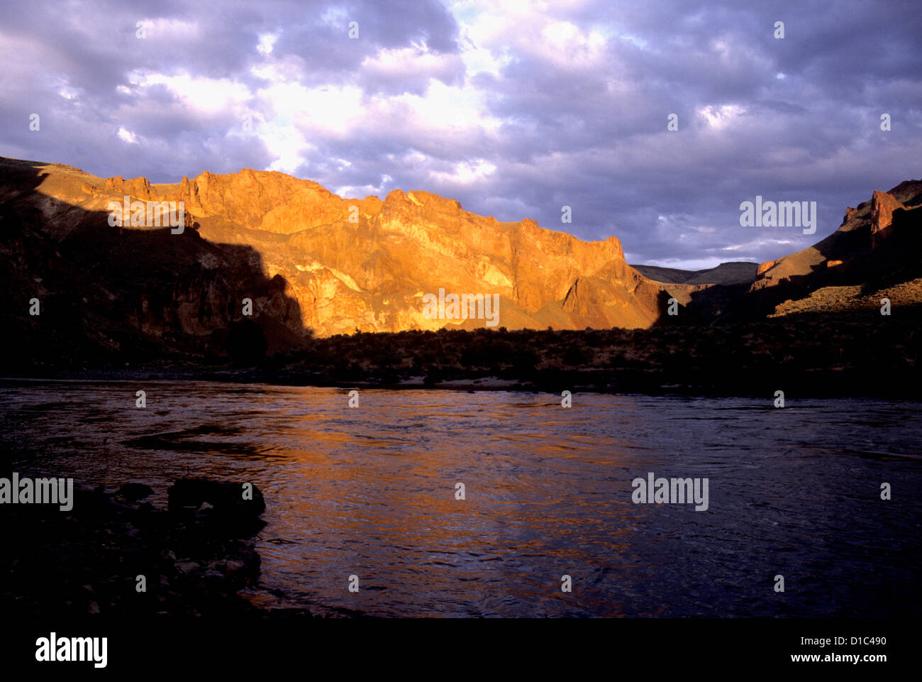 Alpenglow (sunset) reflected off of cliffs above Owyhee River in SE ...