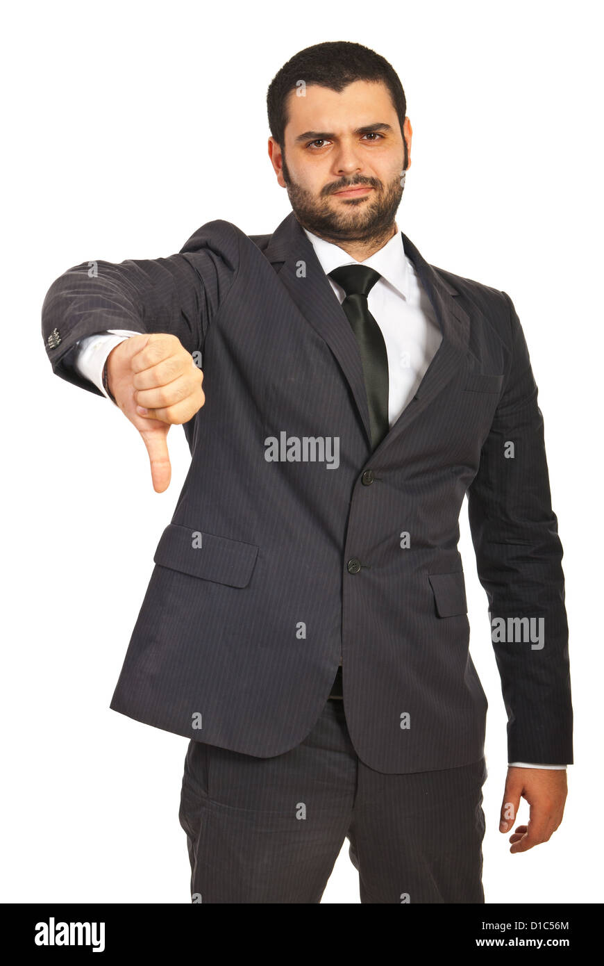 Unhappy business man giving thumb down isolated on white background ...